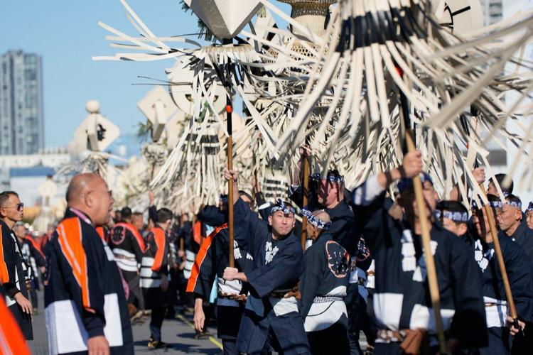 Photos show ladder stunts and other activities at a Tokyo fire brigade ...