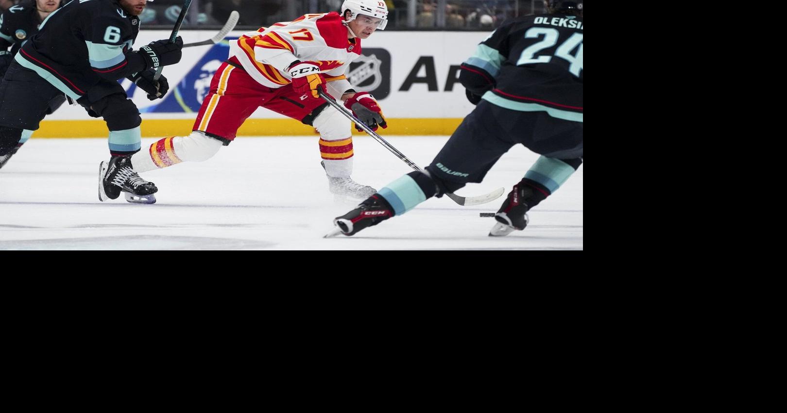 Flames score three times in first period, hang on to beat Kraken 3-2