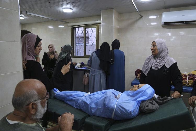 Photos show Palestinians mourning after people were killed in Israeli ...