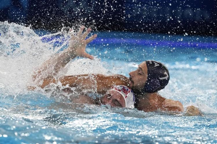 Water polo players wrestle for position at Olympics, but there is a ...