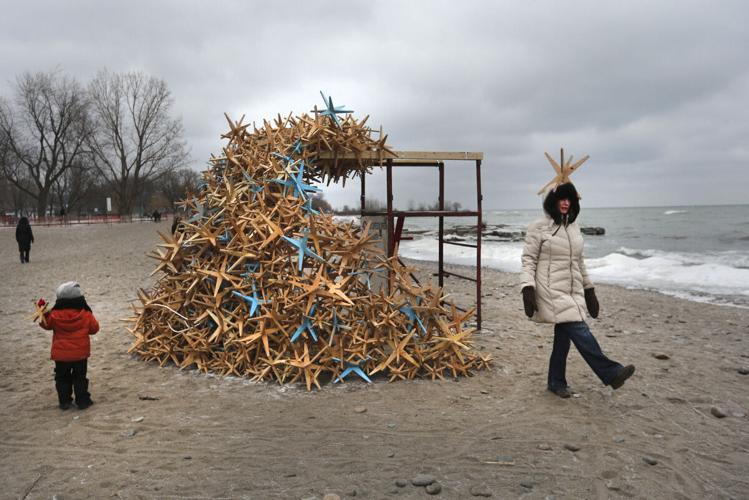 Art on the beach gets a warm reception, especially when it’s warming, too