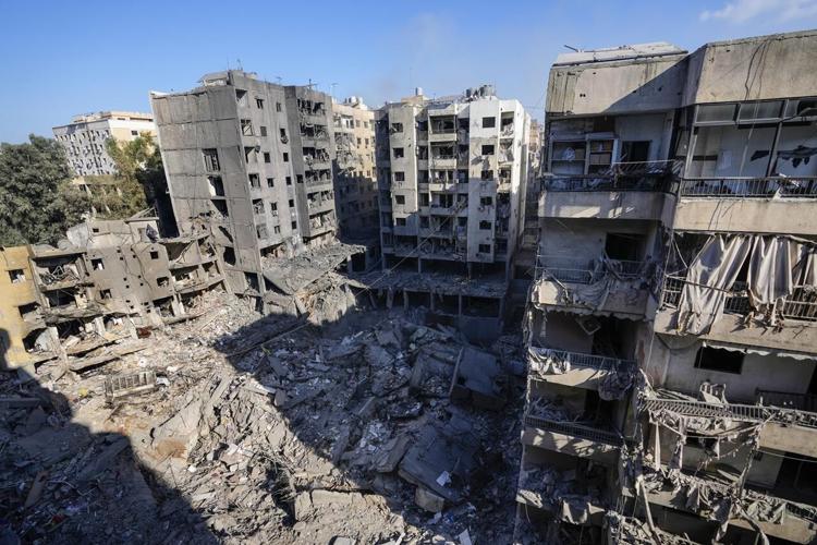 AP images offer a close-up look at the smoldering site of Nasrallah's ...