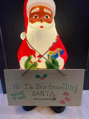 Travelling Santa popping up on porches around Paris