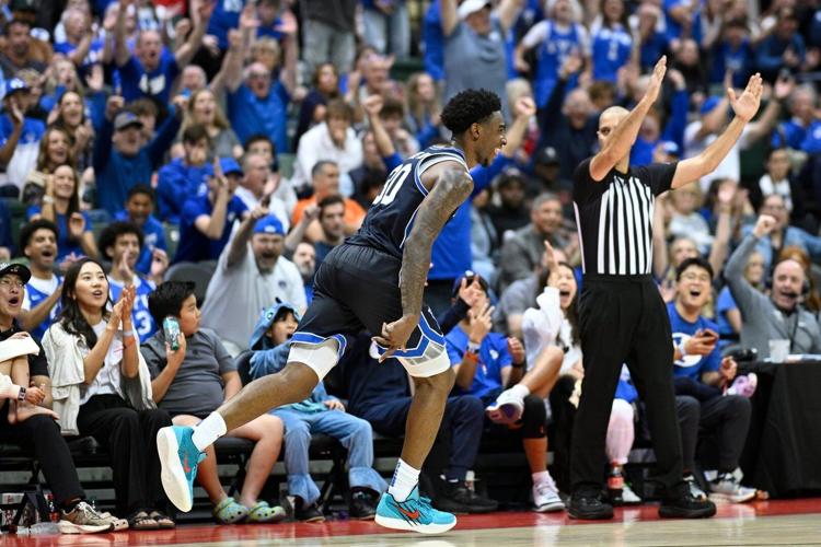 Davis scores 18, No. 9 BYU uses second-half surge to beat Miami 72-62