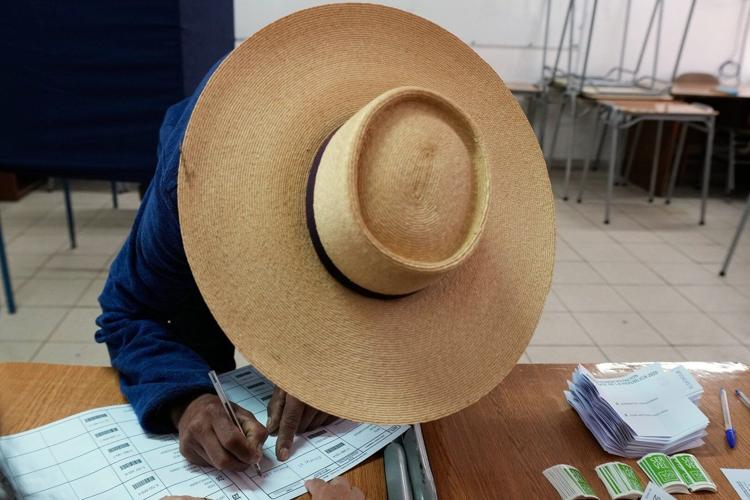 Photos of voters taking part in Chile's runoff presidential election