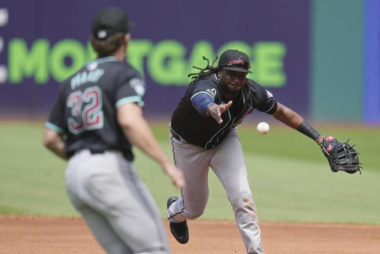 Josh Bell homers twice, drives in three as Diamondbacks beat Guardians ...