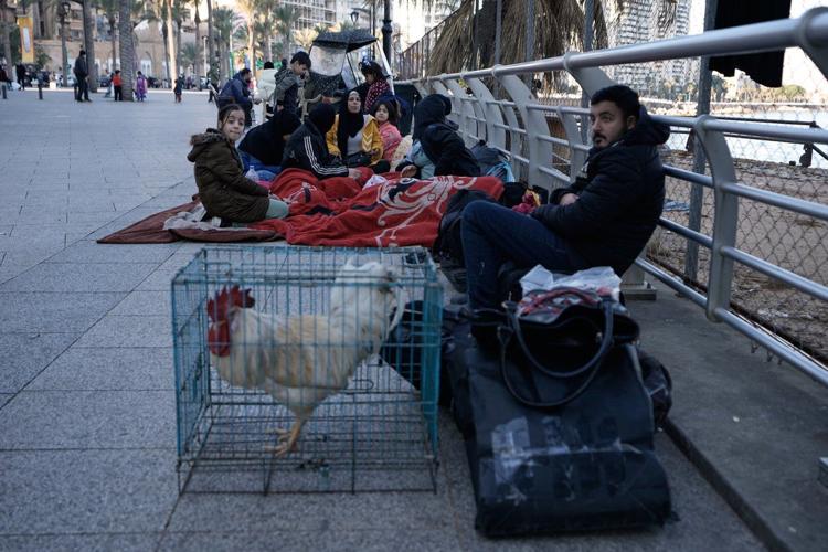 Photos show people fleeing and buildings wrecked after Israeli strikes ...