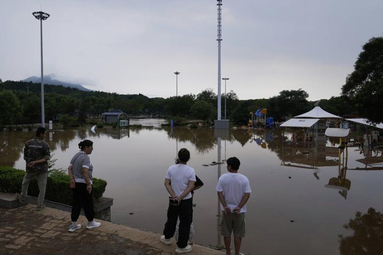 Heavy rain causes flooding, evacuations and at least 38 deaths around ...