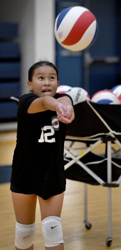 Funny hats, glasses worn at Mountain Volleyball Program camp