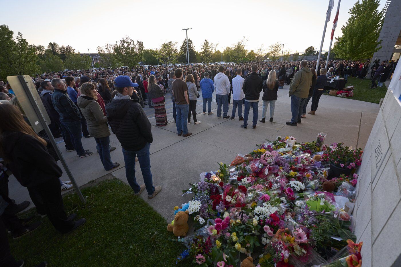 Hundreds mourn outside school for students and coach killed in Ontario ...