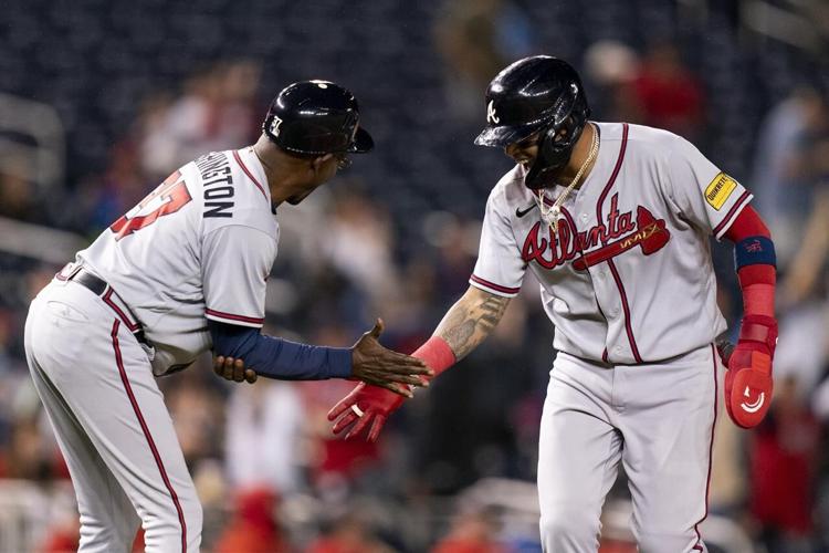 Braves reach 100 wins again, beat Nationals 8-5 behind Strider to ...