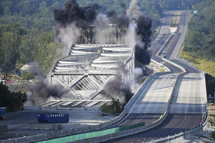 Explosives drop steel trestle Missouri River bridge into the water ...