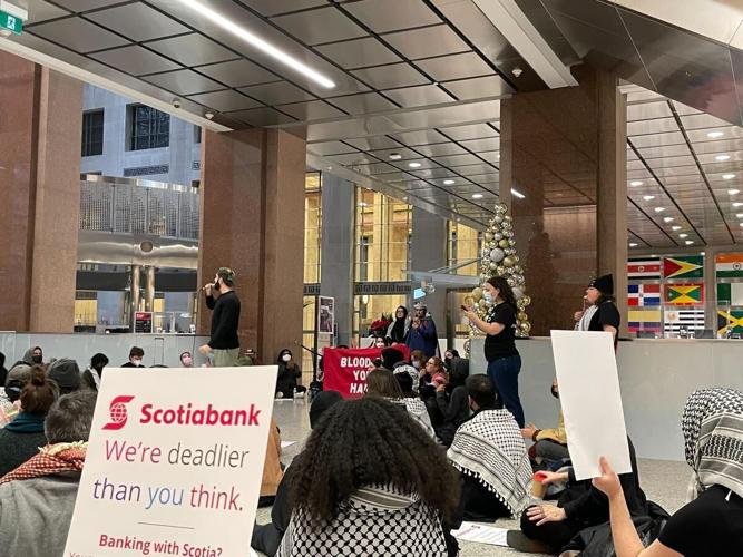 Pro-Palestinian protesters and police clash at Scotiabank HQ