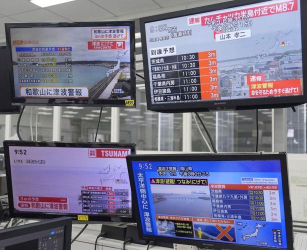 The Latest: Tsunami warnings lifted in most places