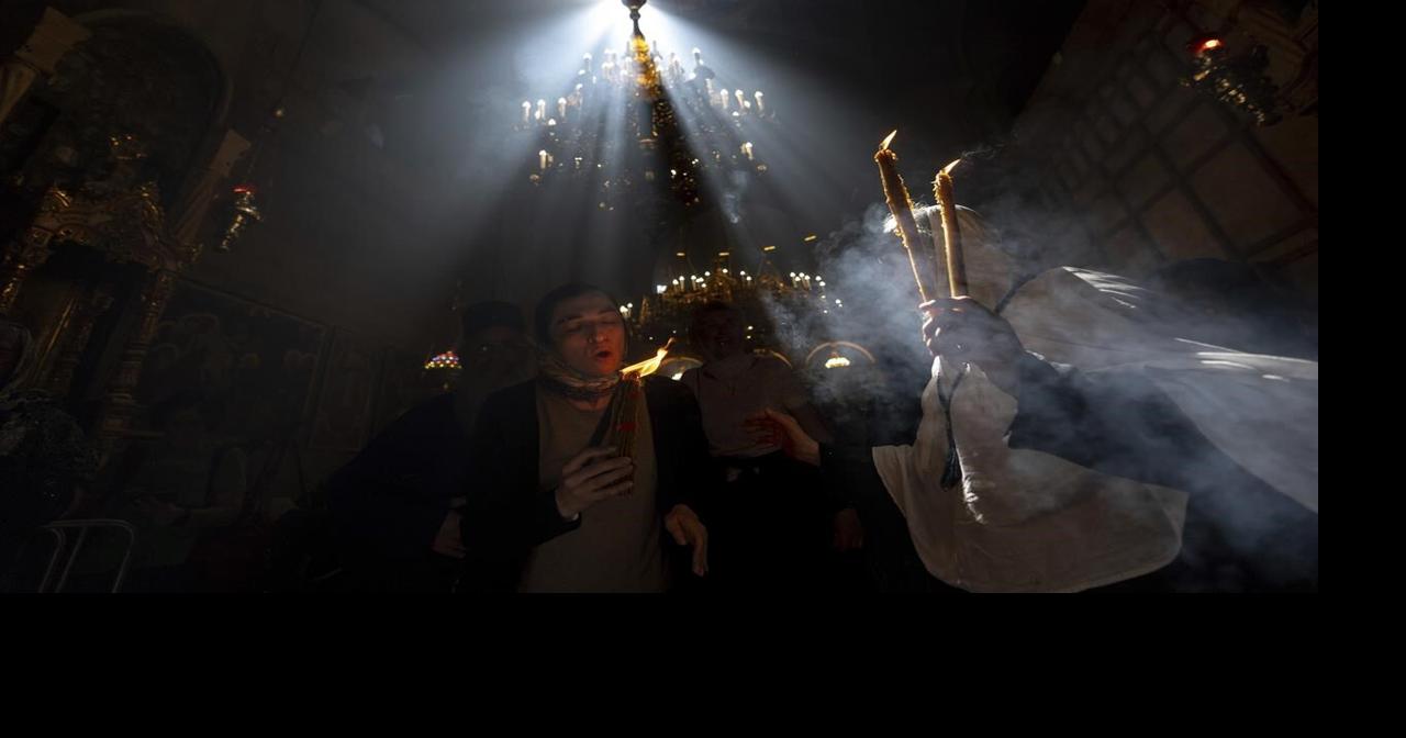 Cheers and flames as Orthodox worshipers greet the ancient ceremony of ...