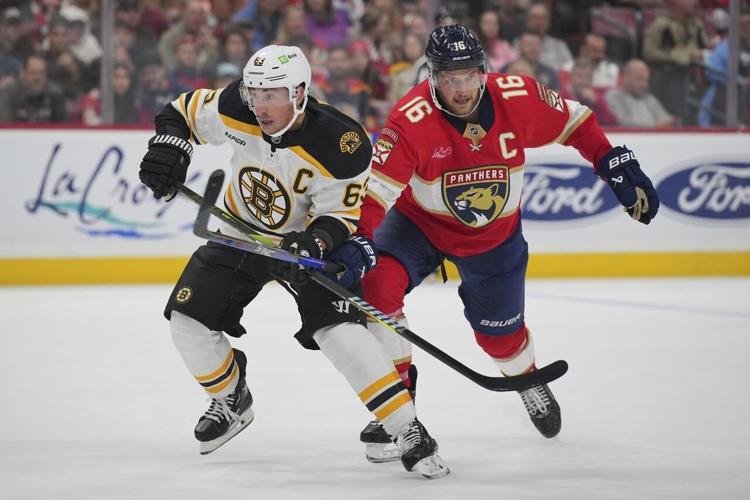 Bennett scores twice, Panthers open their title defense by getting past ...