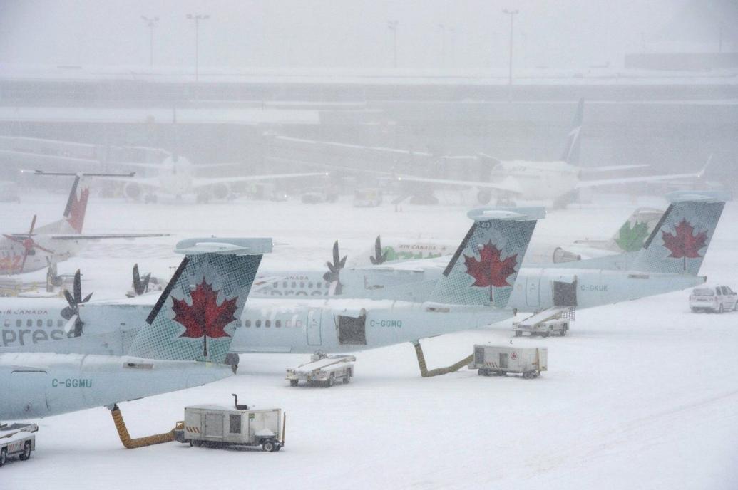 Snowstorm wreaks havoc on air travel plans, as hundreds more flights ...