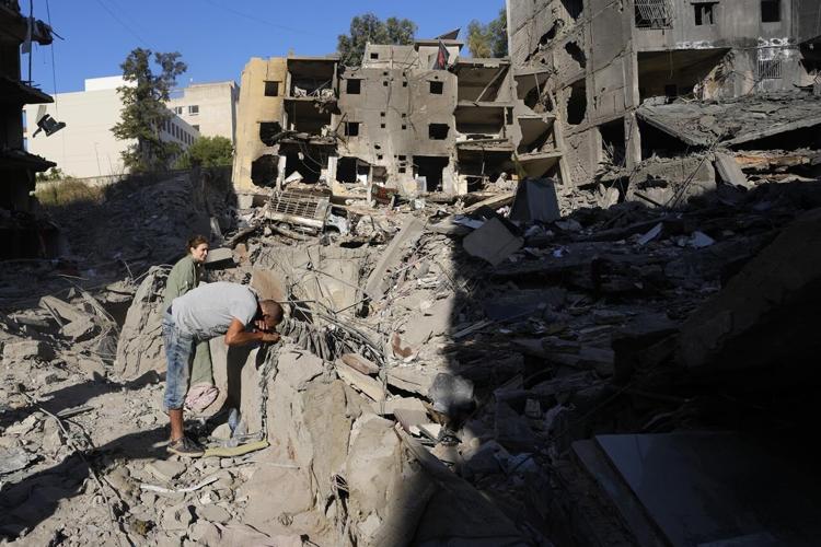 AP images offer a close-up look at the smoldering site of Nasrallah's ...