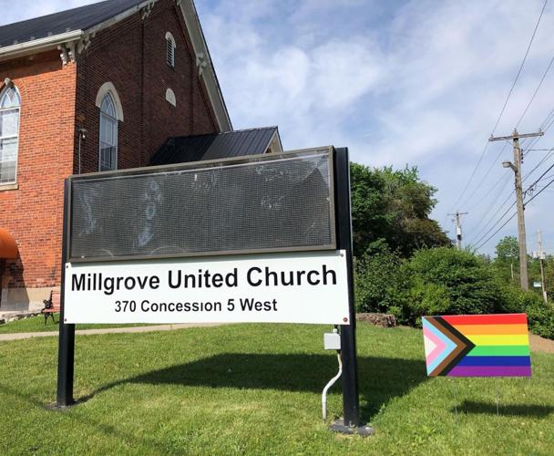Pride sign back up at Millgrove church after disappearance