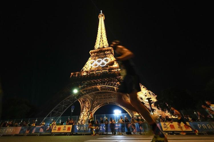 Amateur runners race like Olympians along the same iconic route as ...