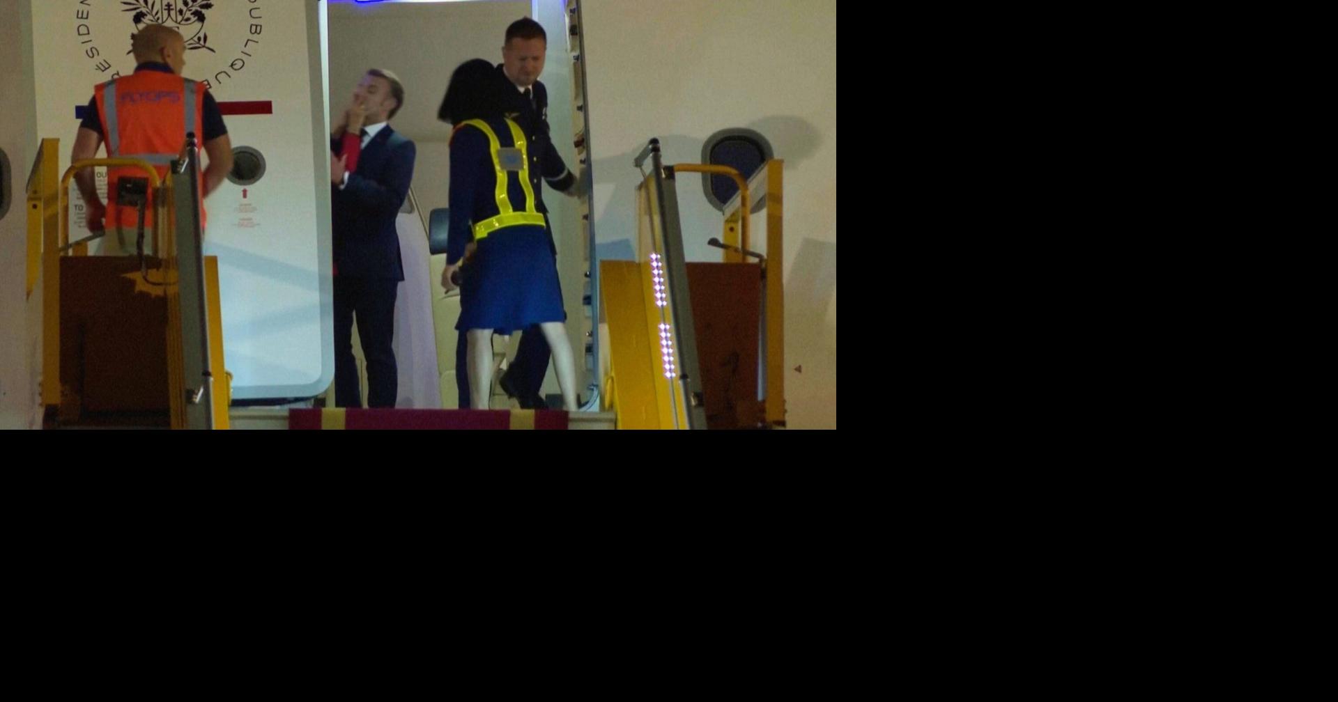 France's first lady seems to push her husband as they land in Vietnam ...