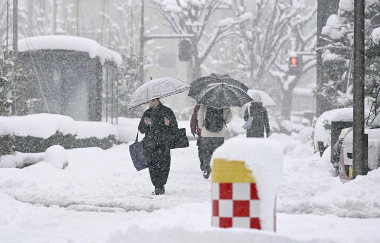 Heavy snow in northern Japan blocks roads and causes dozens of deaths