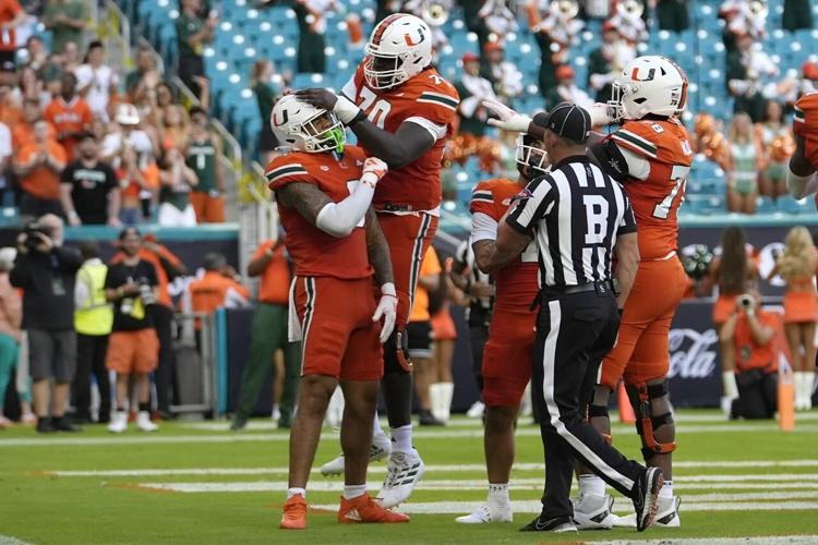 Cam Ward passes for 3 TDs, runs for another and No. 12 Miami rolls past ...