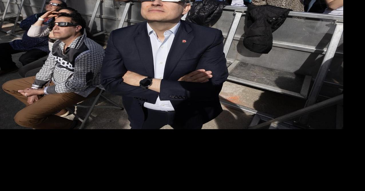 MPs clad in eclipse glasses stare at 'surreal' celestial event on ...