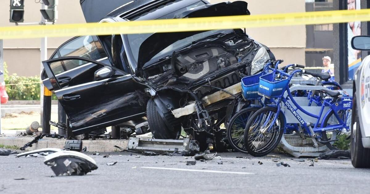 One man charged after vehicle lands on row of SoBi rental bikes
