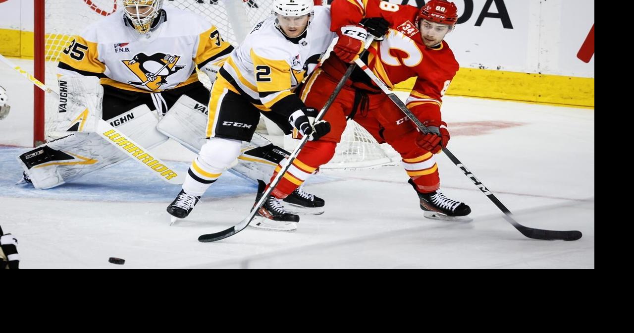 Sharangovich shines as Flames rally to burn Penguins 4-3