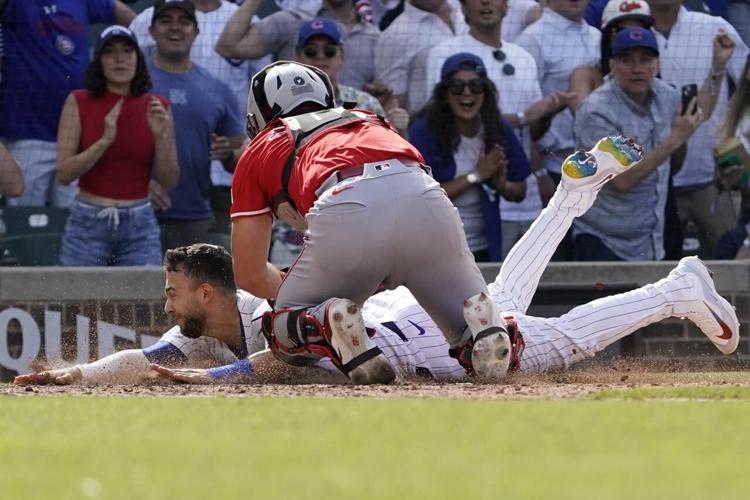 Santiago Espinal hits 2-run homer, Reds hold on to beat Cubs 5-4