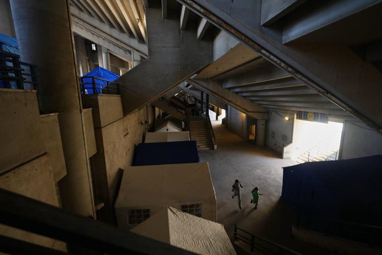 Photos of displaced civilians in Lebanon, where schools and stadiums ...