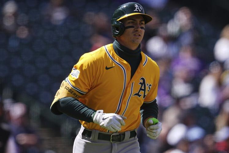 Chase Dollander wins his major league debut as Rockies top Athletics 12-5