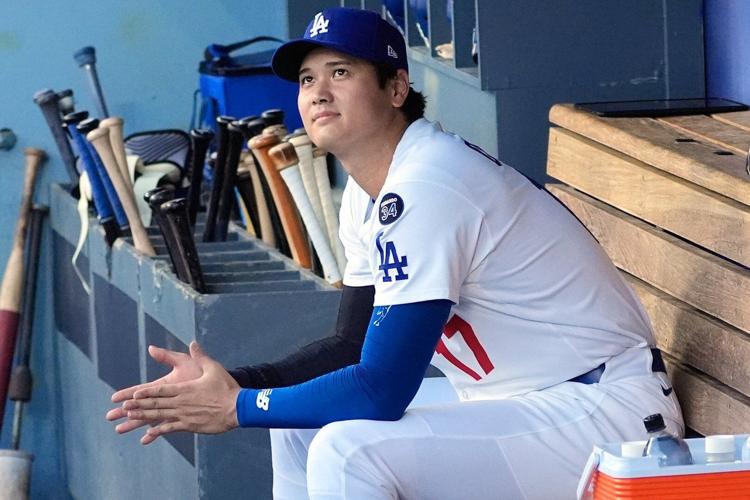 Ohtani hits 2 homers for Dodgers in playoff opener against Reds