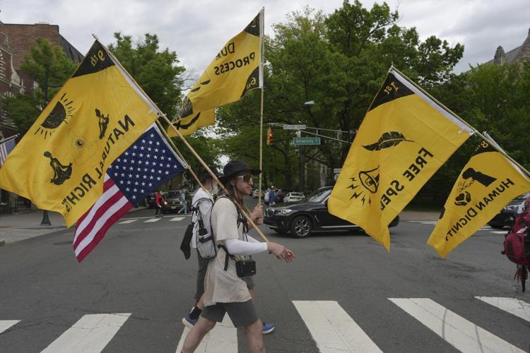 Quakers march against Trump’s crackdown on immigrants carrying on their ...