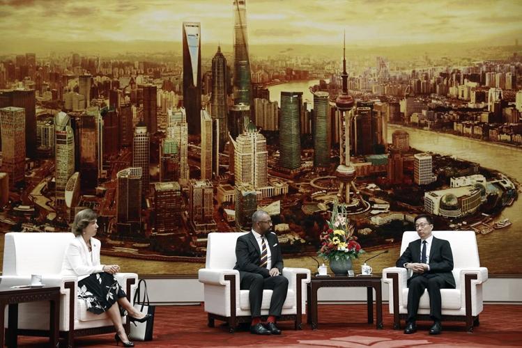 Britain's top diplomat raises human rights concerns with China ...