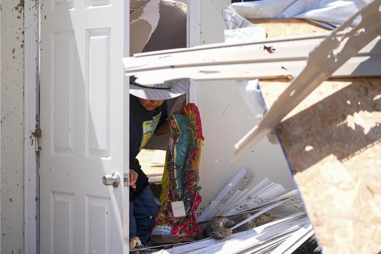In a north Texas county, dazed residents sift through homes mangled by a tornado