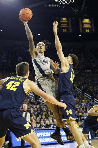 Tre Donaldson scores 7 during Michigan's game-closing 9-0 run for a 76 ...