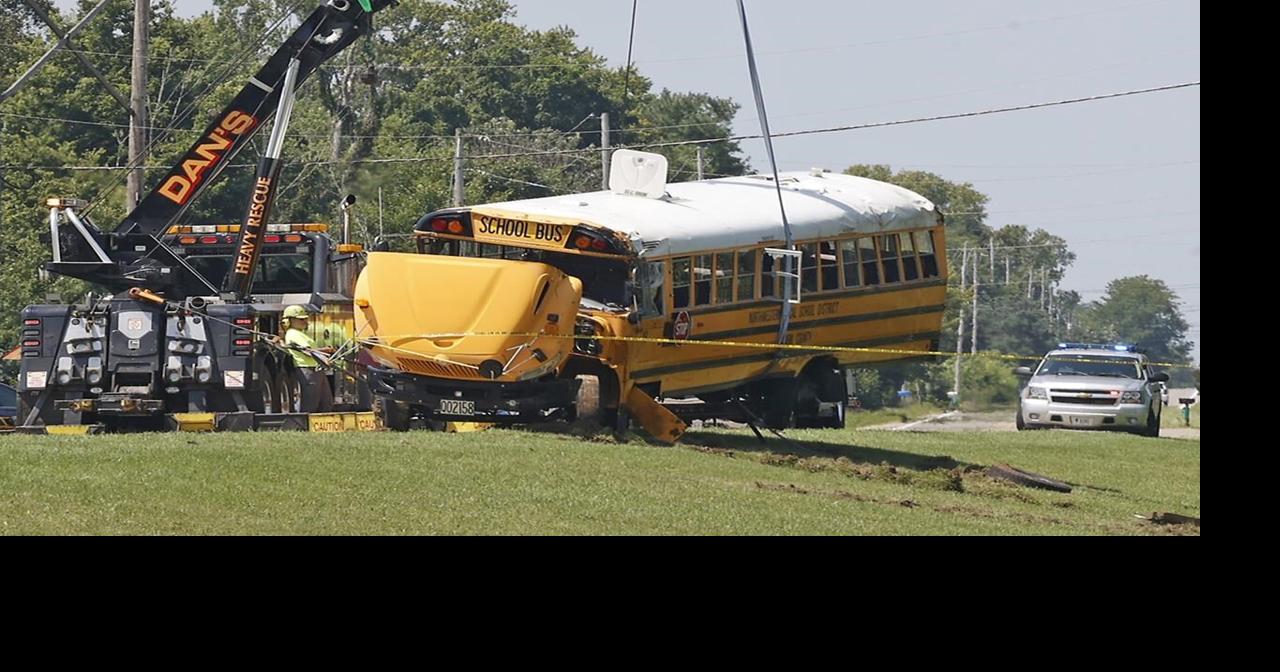 An Ohio school bus overturns after crash with minivan, leaving one ...