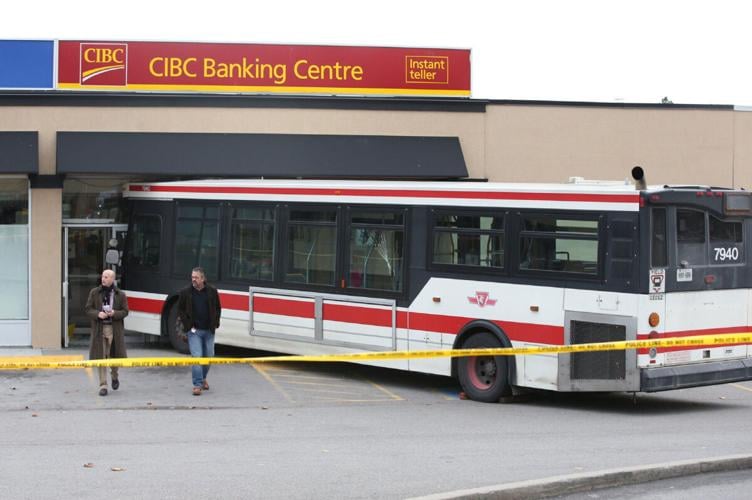 TTC bus hits car, crashes into building; one dead
