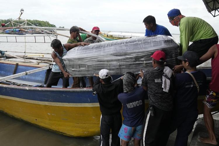 Philippine ferry was overloaded when it flipped over, leaving 27 dead ...