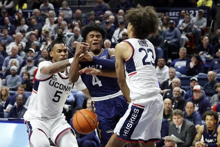 No. 6 UConn unveils its 5th championship banner, routs Northern Arizona ...