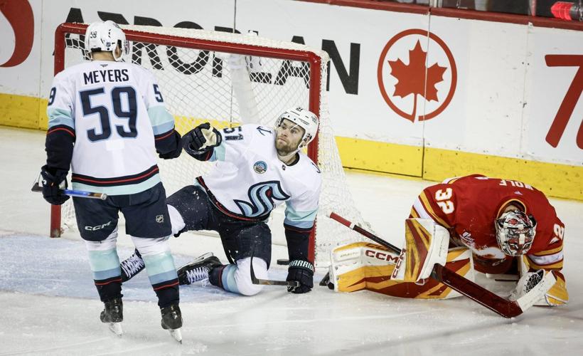 Surging Kraken score four times in third period to burn Flames 5-1