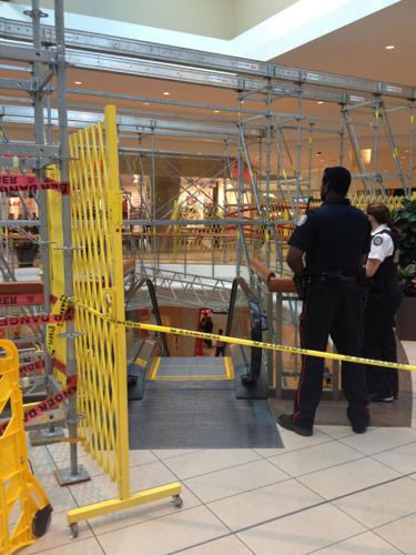 kid falling down escalator