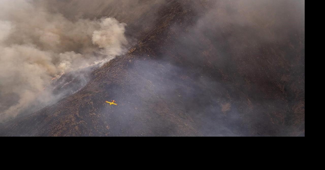 Rainfall helps firefighters control southern Spain’s inferno