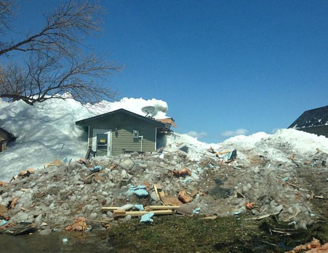 Wall of ice blows out of Manitoba lake, destroying cottages along beach