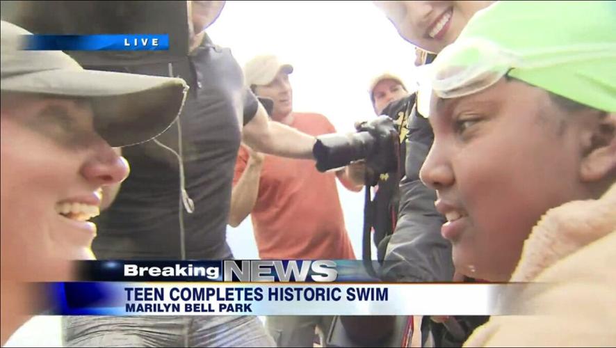 Girl, 14, becomes youngest person to swim across Lake Ontario