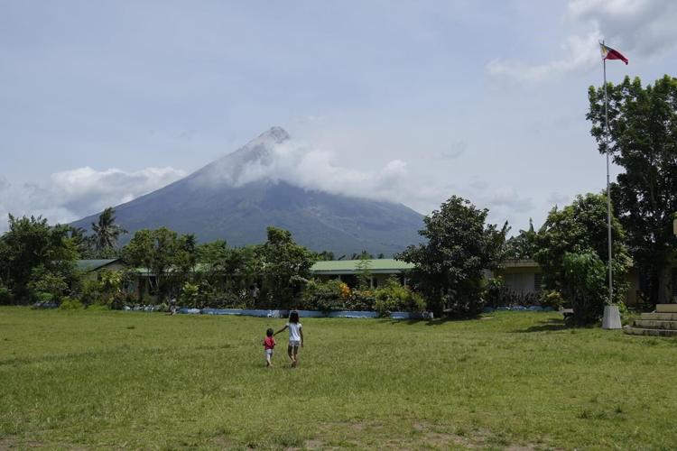 Philippine villagers flee ashfall, sight of red-hot lava from erupting ...