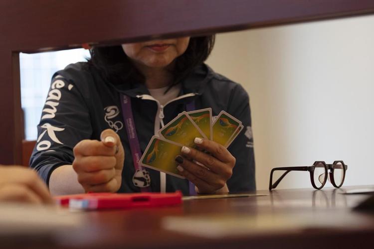 The centuries-old card game of bridge offers a sharp contrast to ...