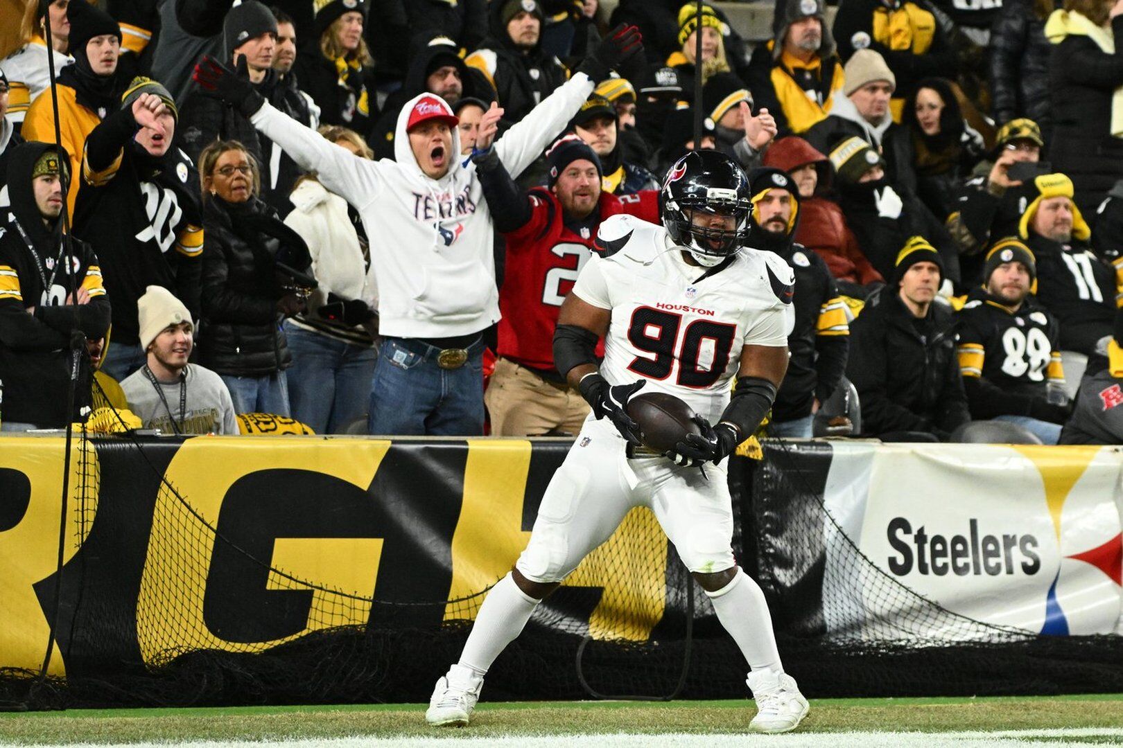 Texans secure first road playoff win with suffocating defensive performance